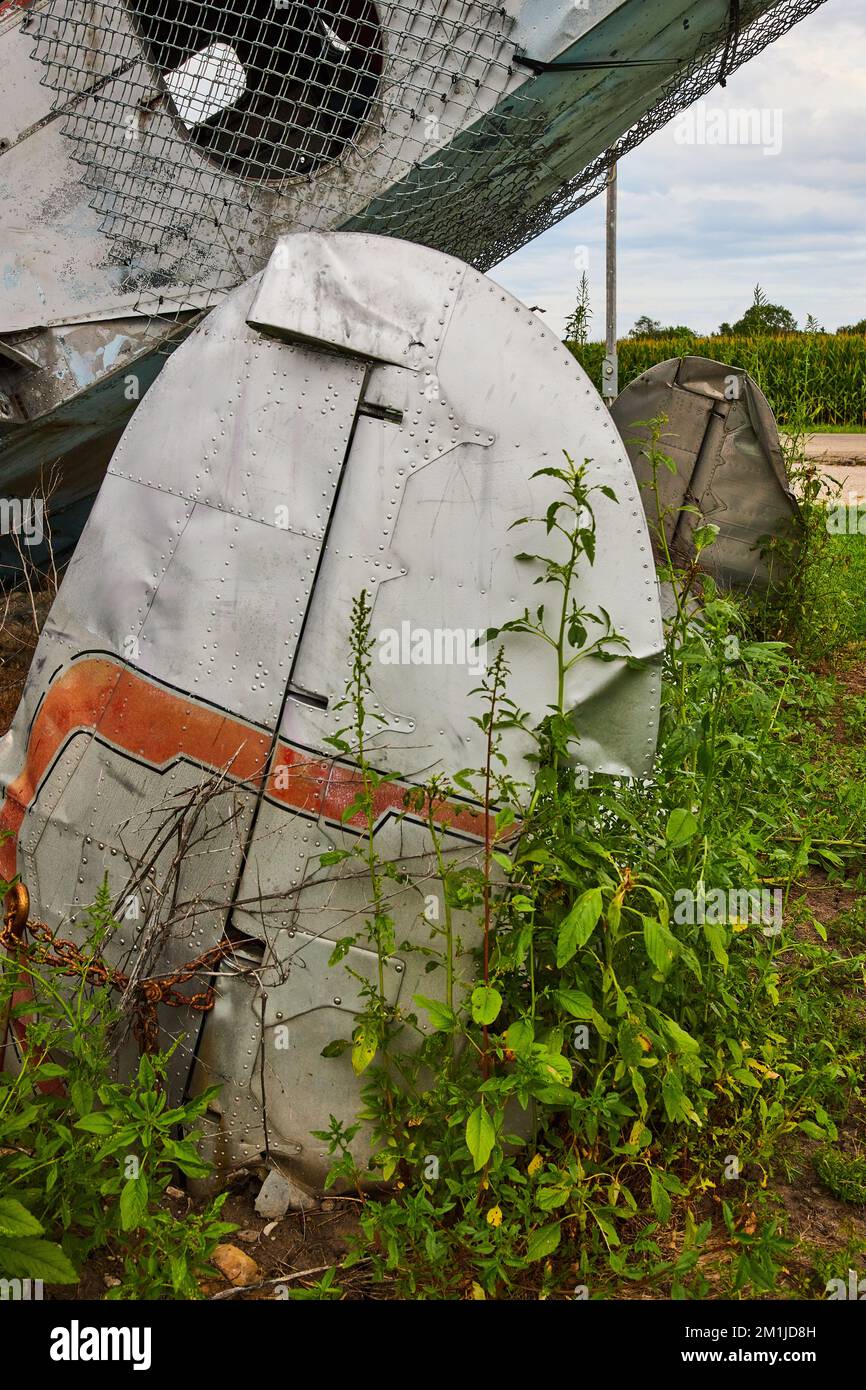 Detail of back on crashed airplane in field covered in weeds Stock ...