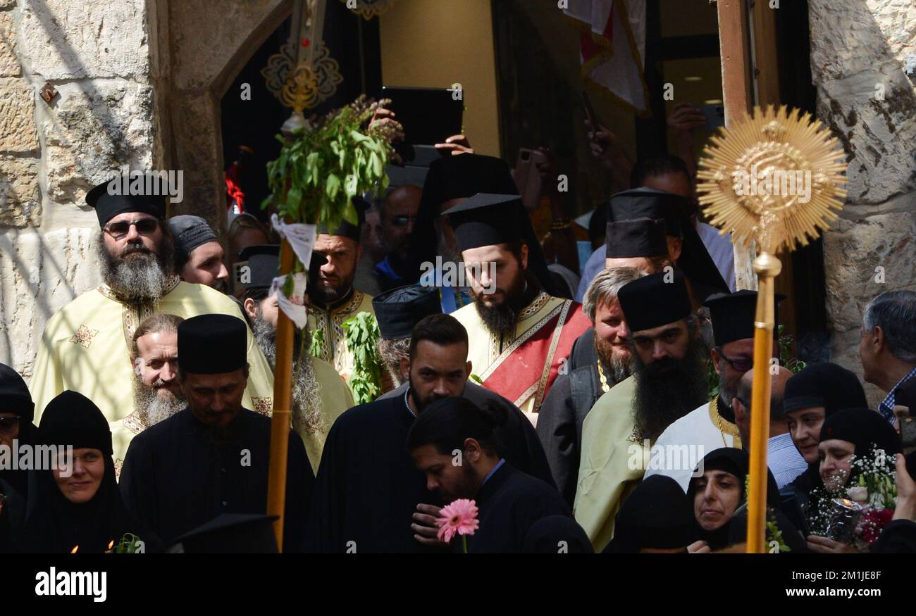 Greek Orthodox priests and nuns walking in a procession from the Tomb ...
