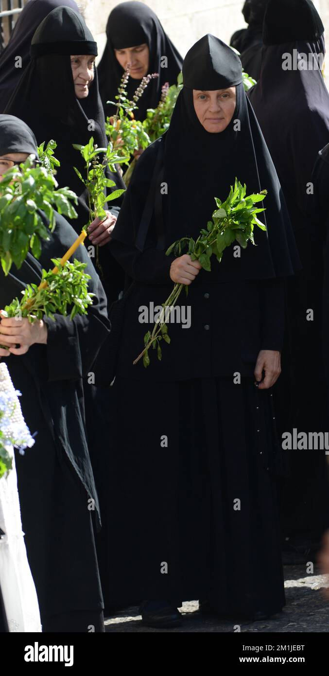 Greek Orthodox nuns walking in a procession from the Tomb off the ...