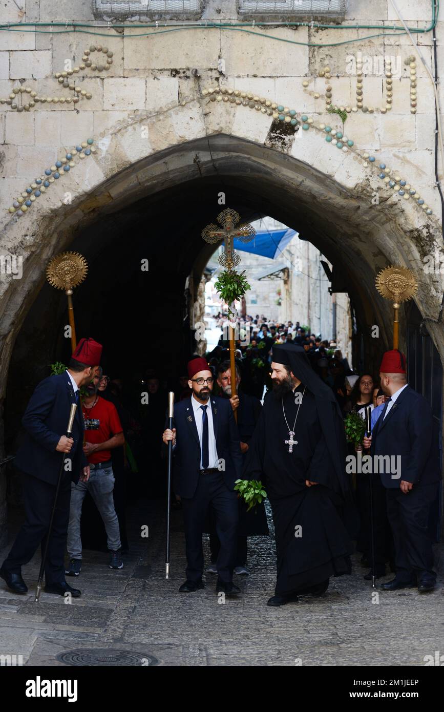 Greek Orthodox priests and nuns walking in a procession from the Tomb ...