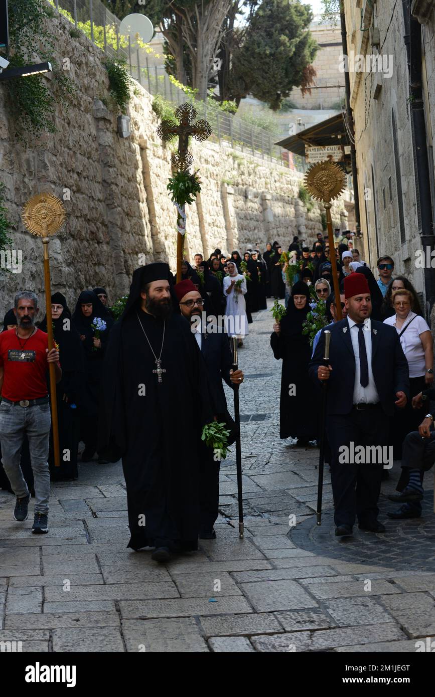 Greek Orthodox priests and nuns walking in a procession from the Tomb ...