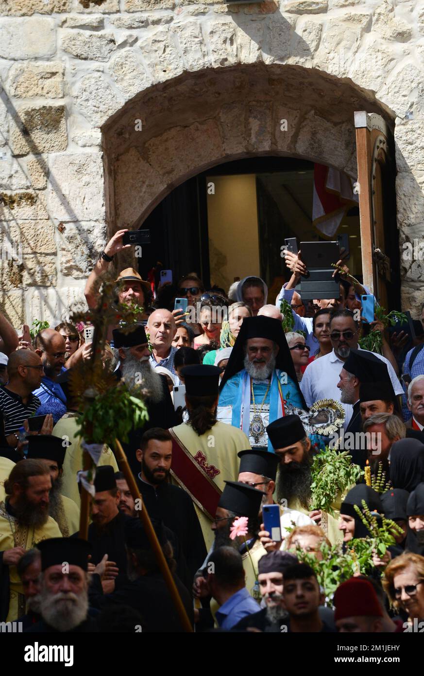 Greek Orthodox priests and nuns walking in a procession from the Tomb ...