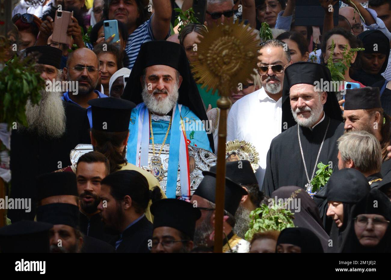 Greek Orthodox priests and nuns walking in a procession from the Tomb ...