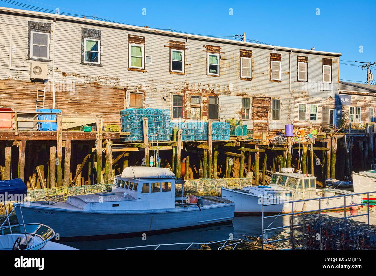 Maine seafood fishing port with containers for catching lobster Stock ...