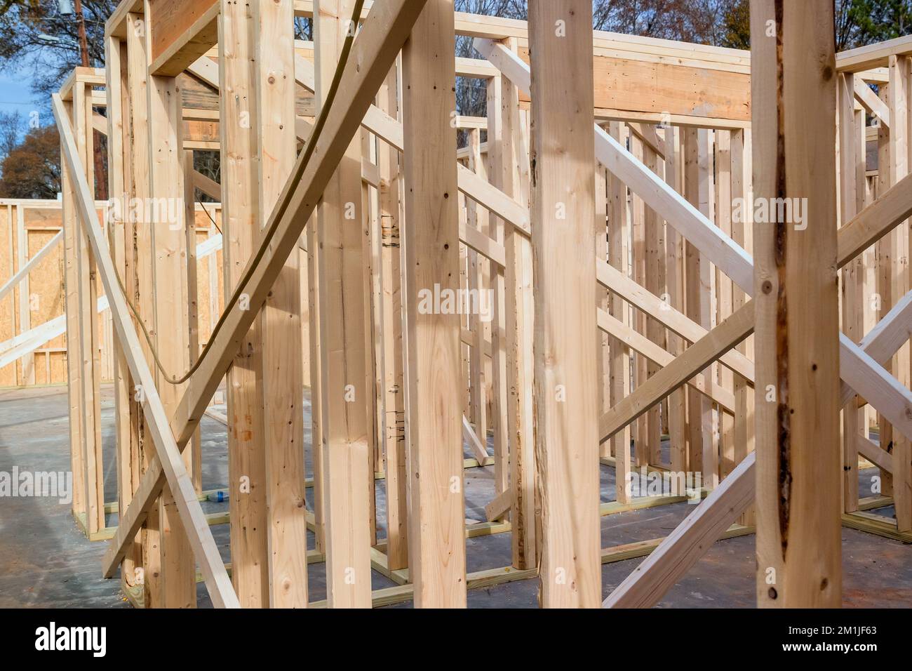 Wood framing beams of new house under construction in construction stage Stock Photo - Alamy