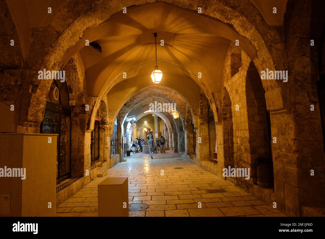 Walking through the ancient Cardo in the Jewish quarter in the old city ...