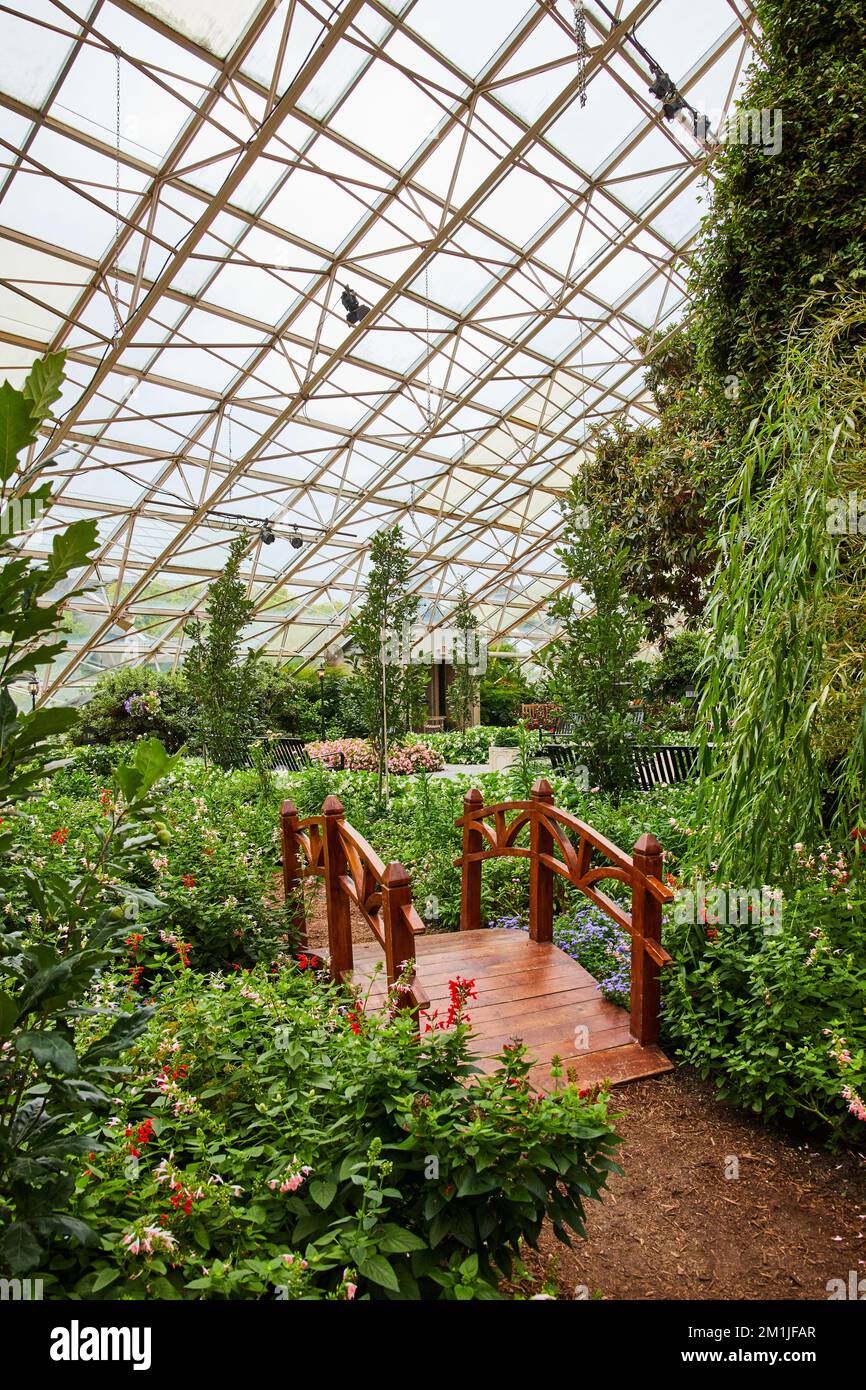 View of walking path and small bridge in Indiana botanical gardens with ...