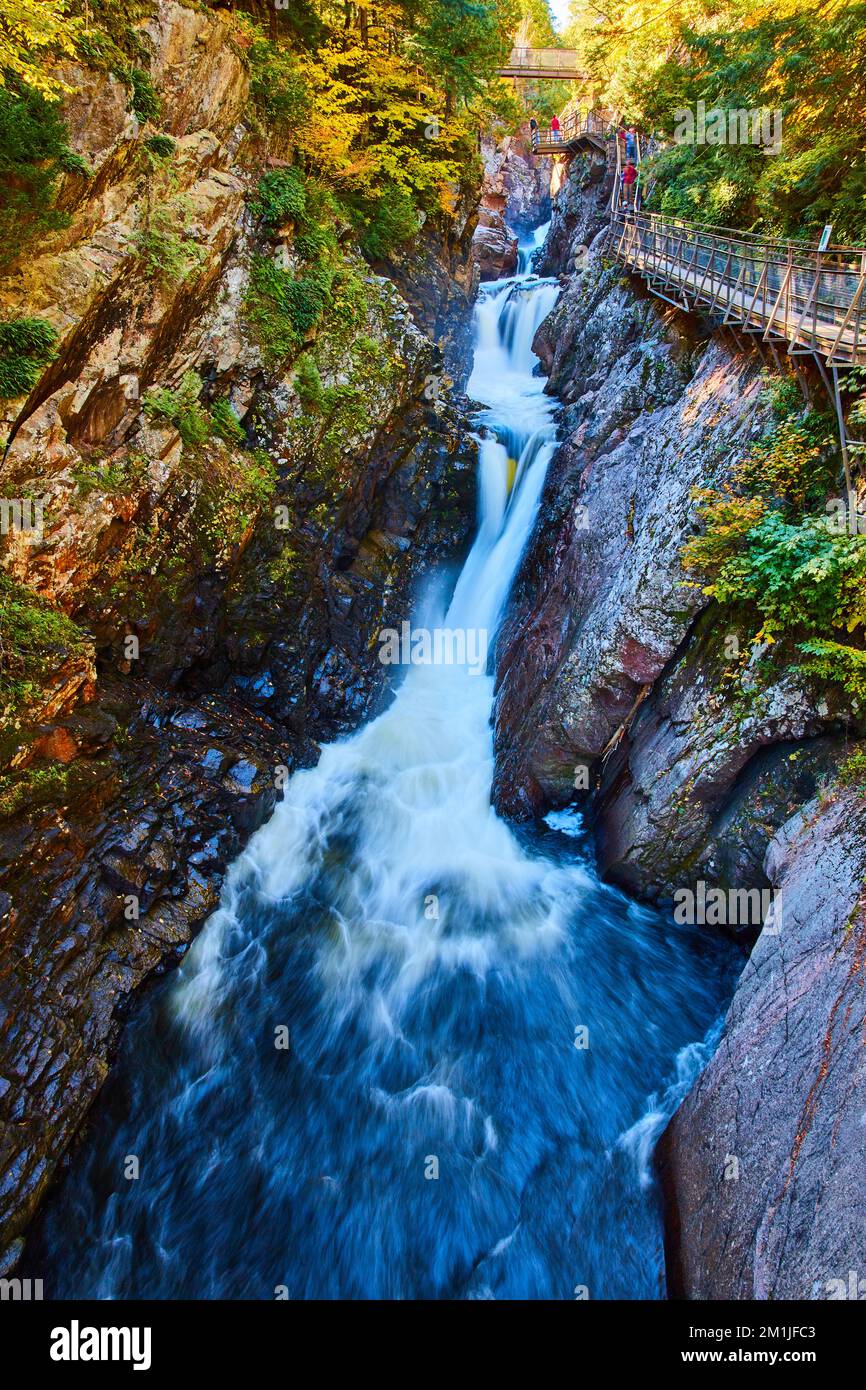 Boardwalk built into cliffs along huge gorge with rapids and large ...