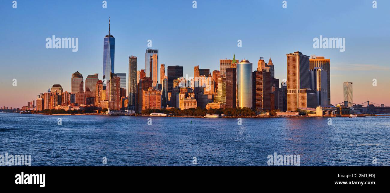 Panoramic golden hour skyline of southern Manhattan New York City ...