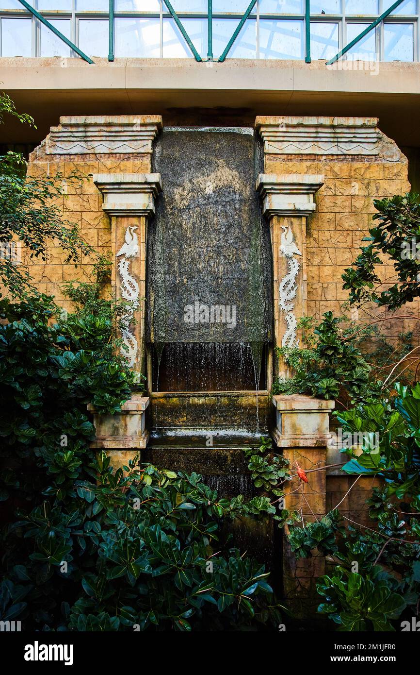 Temple display in bird exhibit with forest and manmade waterfall Stock ...