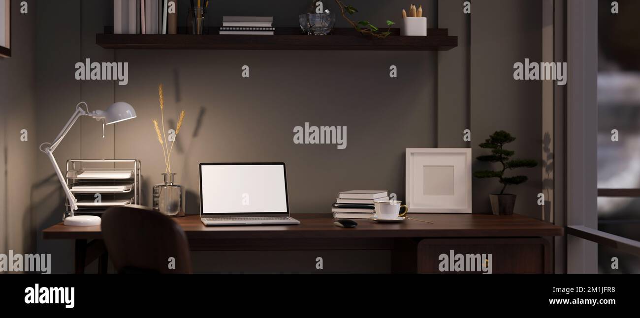 Modern dark office working space at night with laptop white screen ...