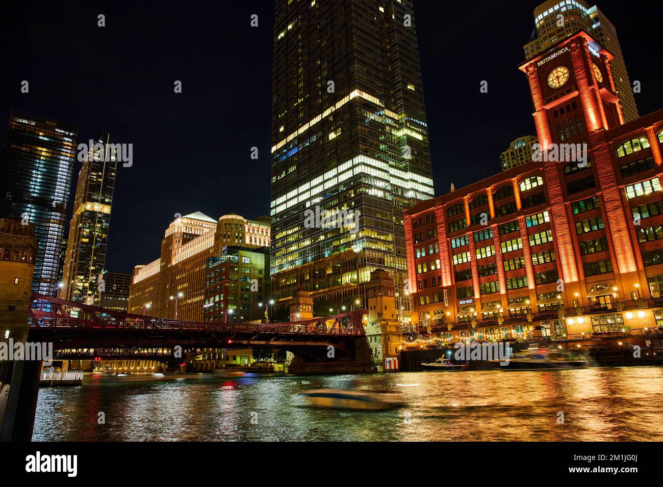 Vibrant clock tower and bridge at night in Chicago ship canals Stock ...
