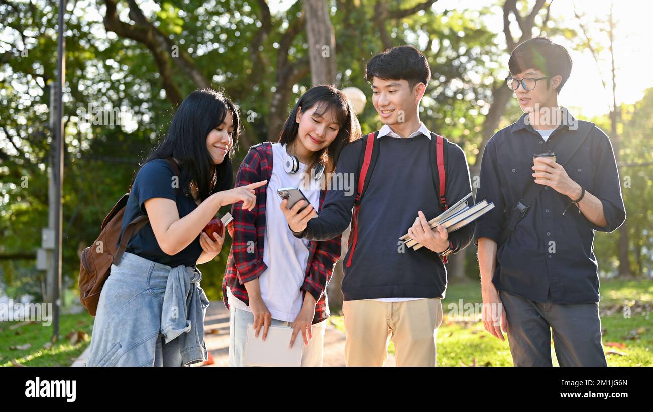 College students walking together in hi-res stock photography and ...