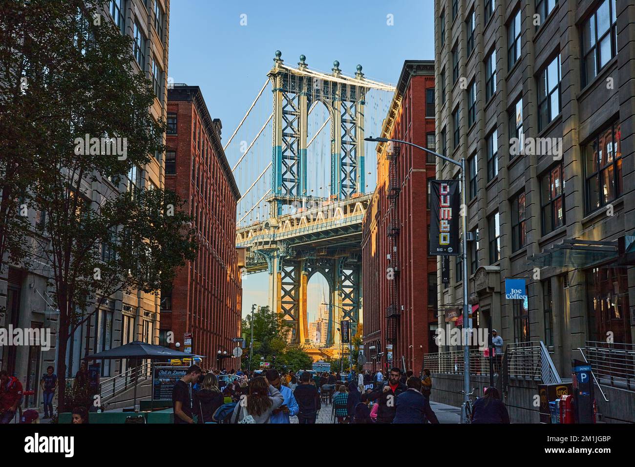 Brooklyn street full of tourists with view of iconic Manhattan Bridge ...