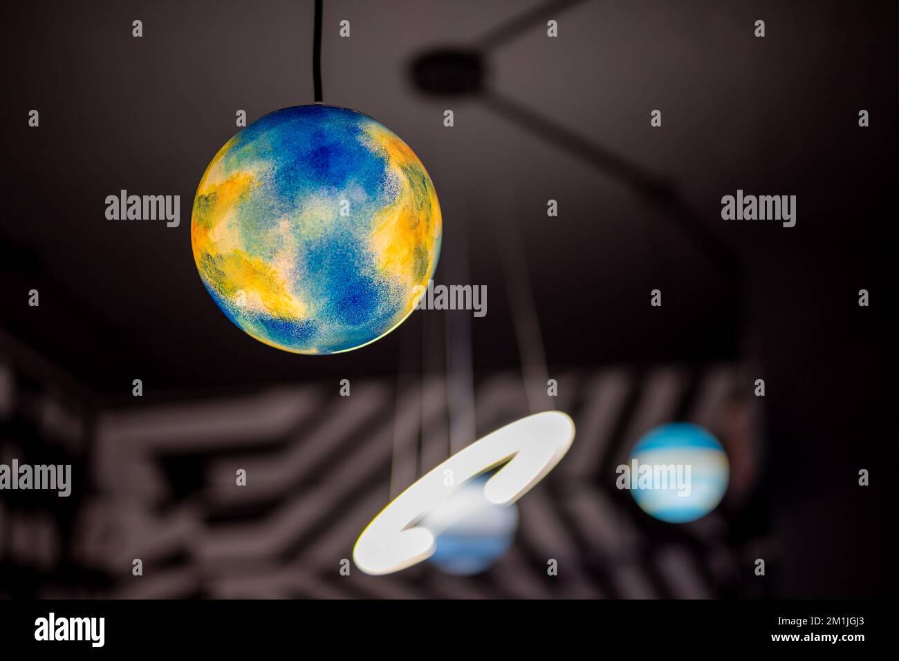 An illuminated of the Planets of Solar System hanging at room interior ...