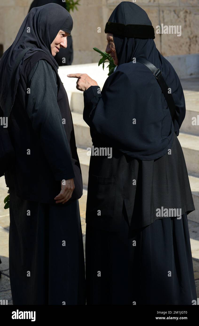 Orthodox Christian nuns gather before the start of a procession from ...