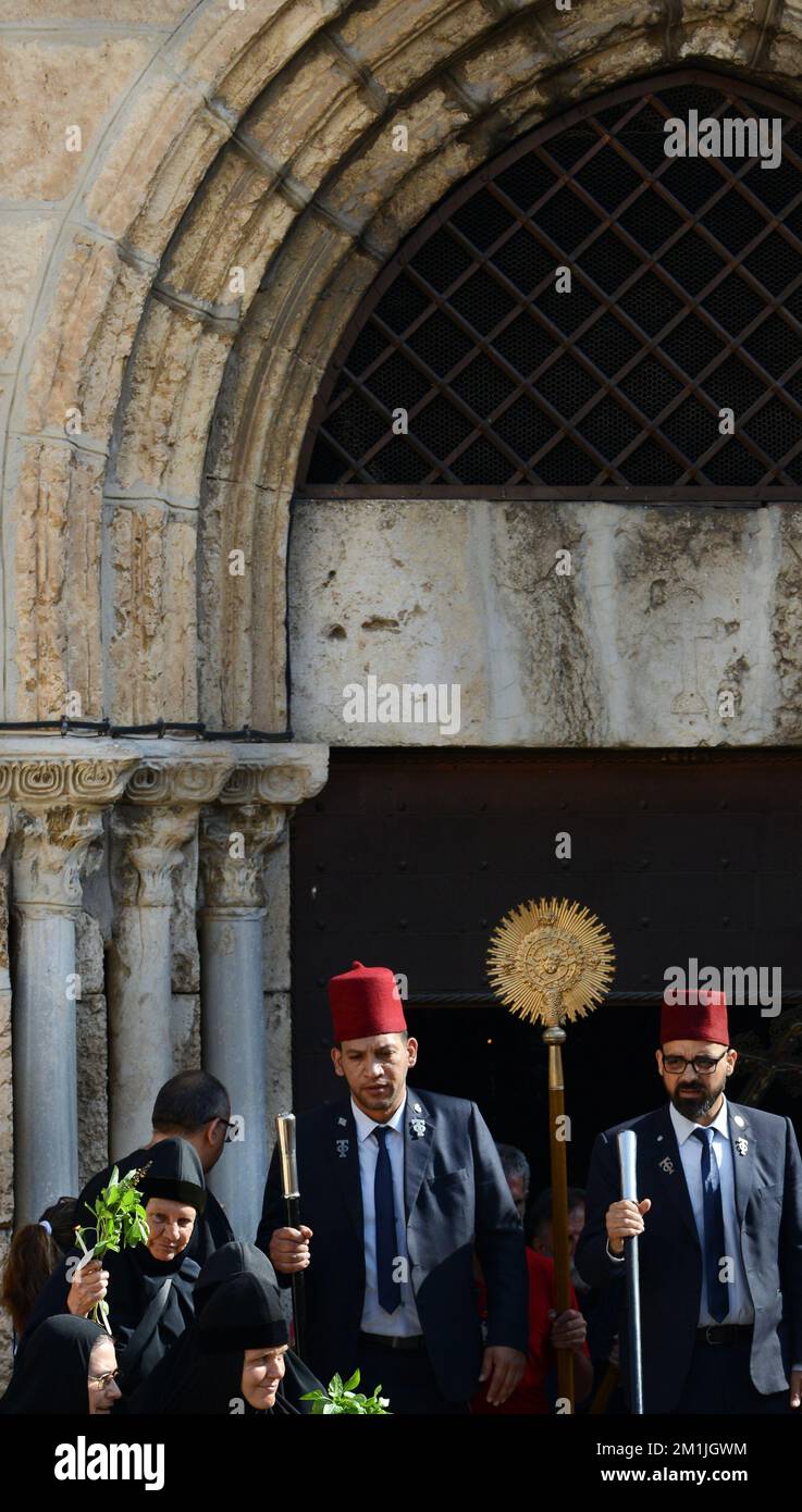 Greek Orthodox priests and nuns walking in a procession from the Tomb ...