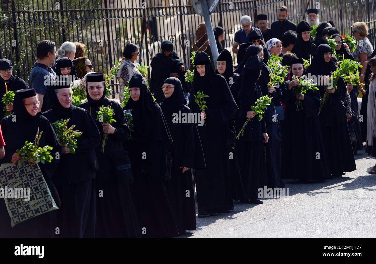 Orthodox Christian nuns walking in a procession from Tomb of the Virgin ...