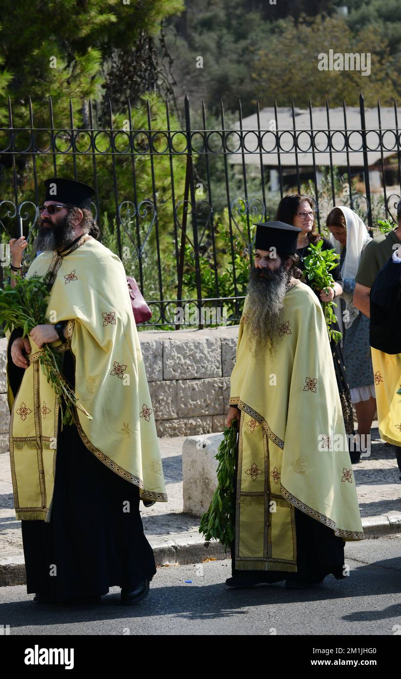 Greek Orthodox priests and nuns walking in a procession from the Tomb ...