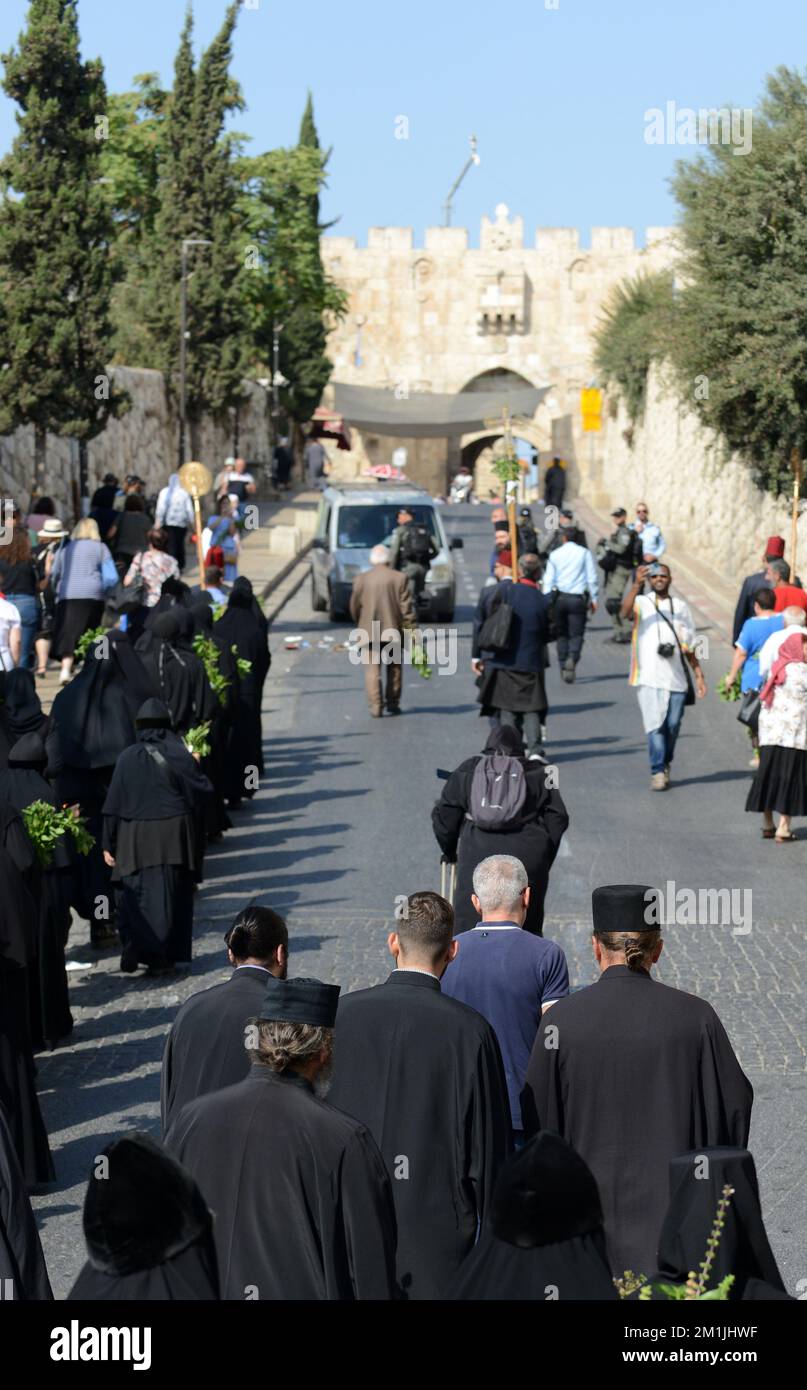 Greek Orthodox priests and nuns walking in a procession from the Tomb ...