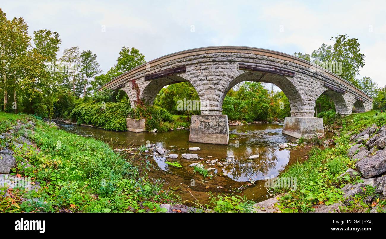 Panorama of 5 arched stone bridge for train track over river Stock ...