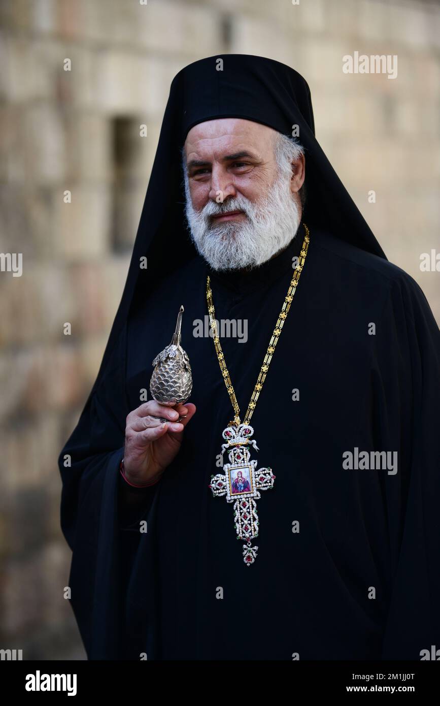 A Greek Orthodox priest Anointing Holy Oil from a traditional Silver ...