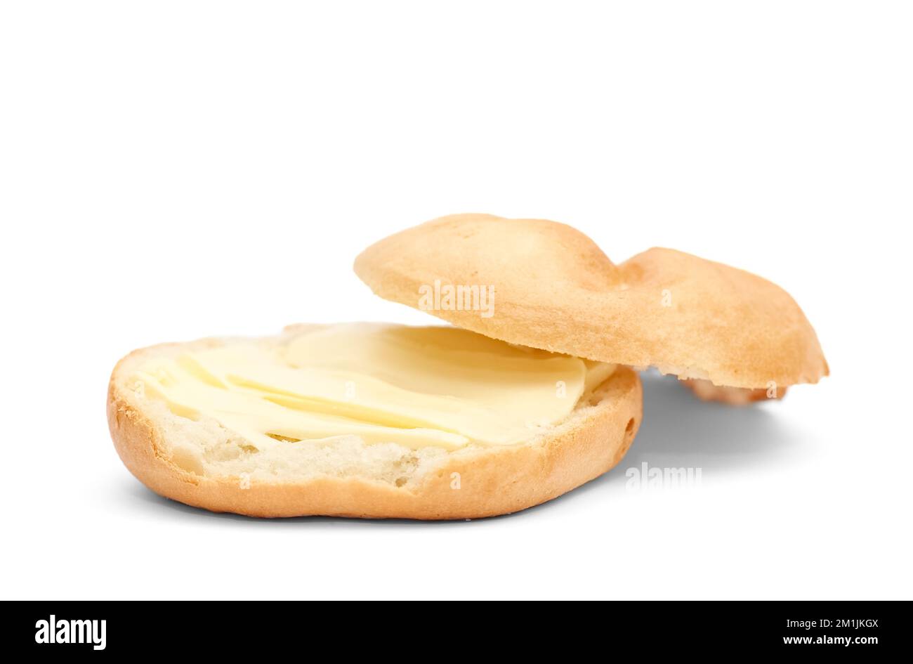 Delicious kaiser roll with butter on white background Stock Photo - Alamy