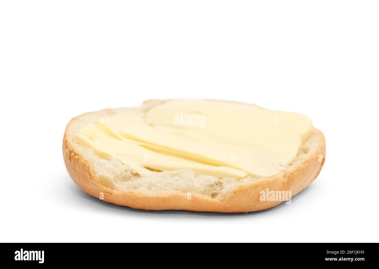 Delicious kaiser roll with butter on white background Stock Photo - Alamy