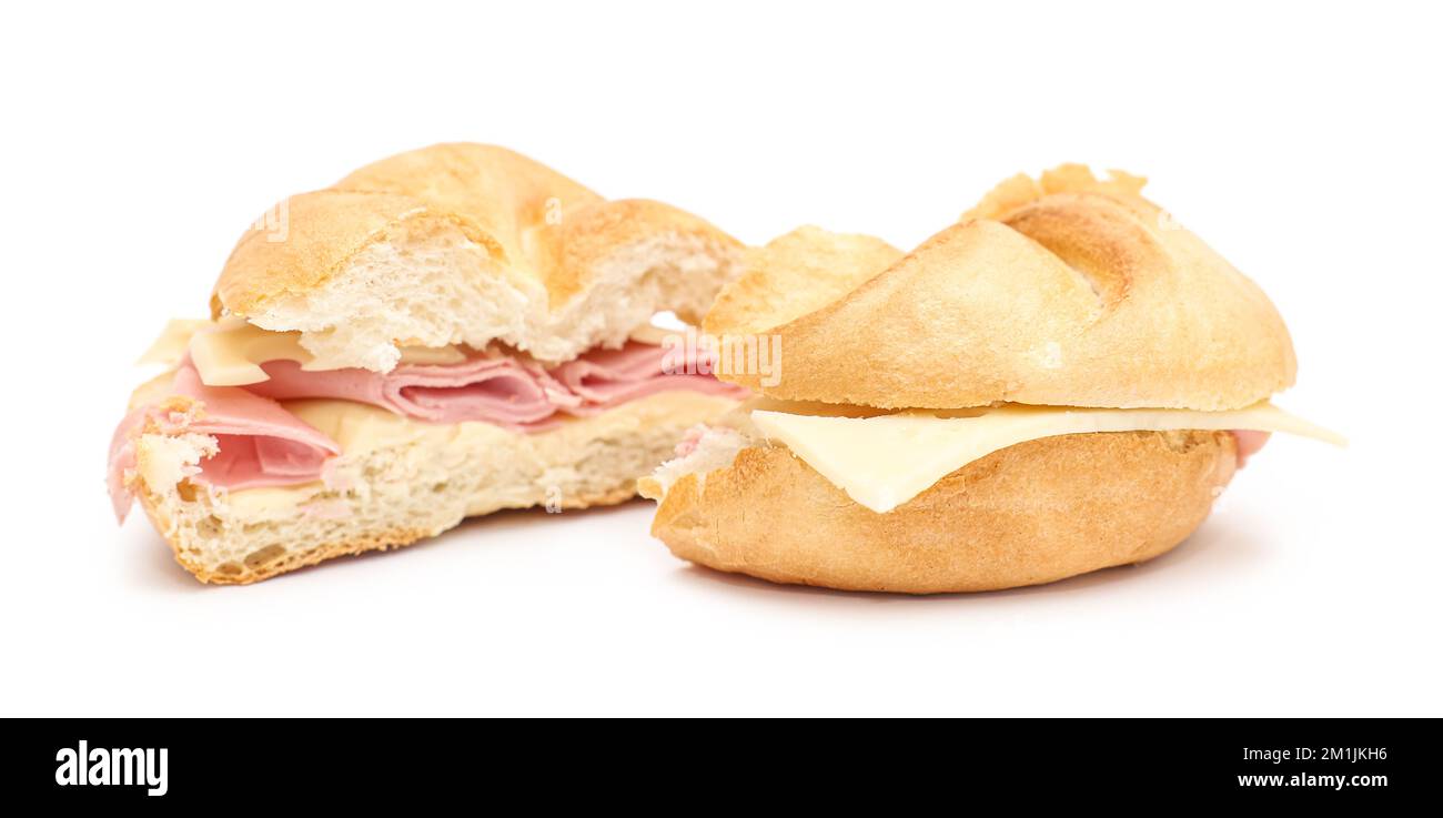 Halves of delicious kaiser roll with ham and cheese on white background ...