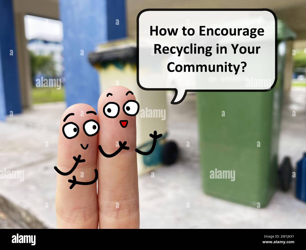 Two fingers are decorated as two person discussing about recycling. One ...