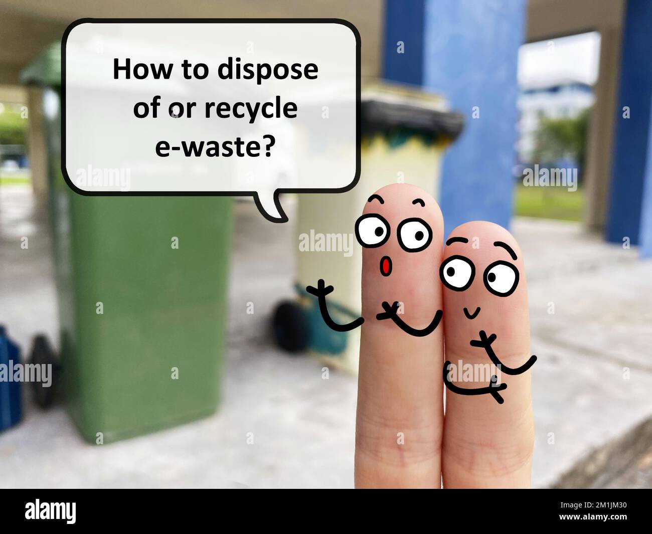 Two fingers are decorated as two person discussing about recycling. One ...