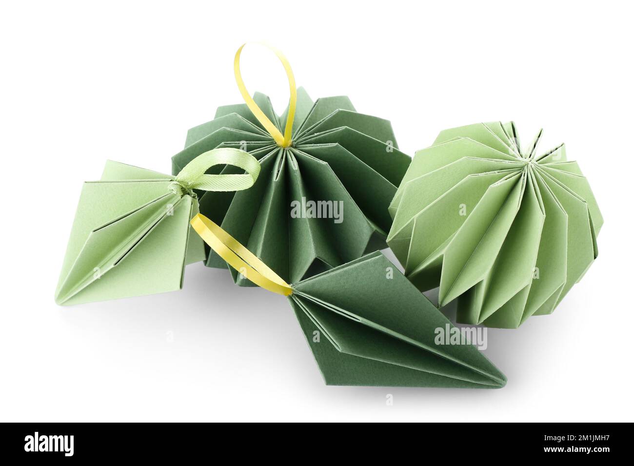Green paper Christmas balls on white background Stock Photo - Alamy