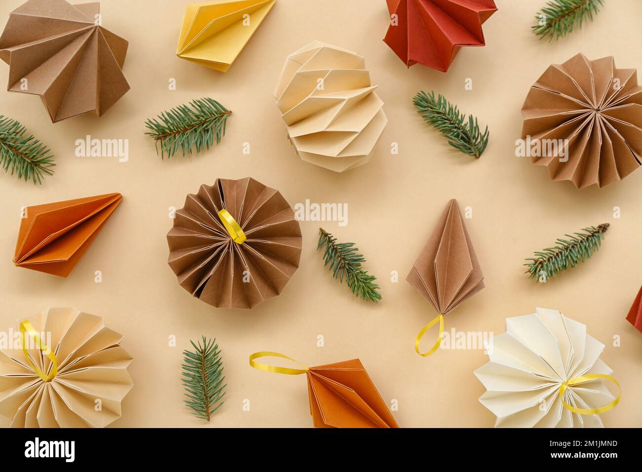 Paper Christmas balls with fir branches on beige background Stock Photo ...
