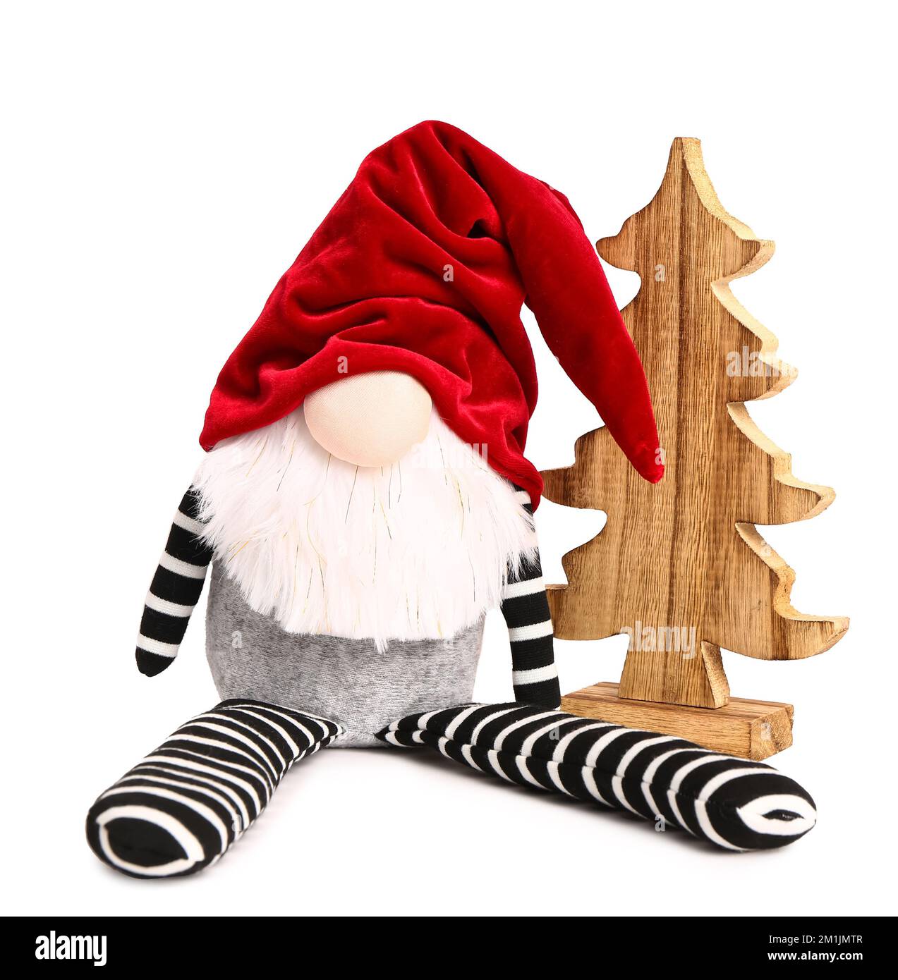 Christmas gnome toy and wooden tree figure isolated on white background ...