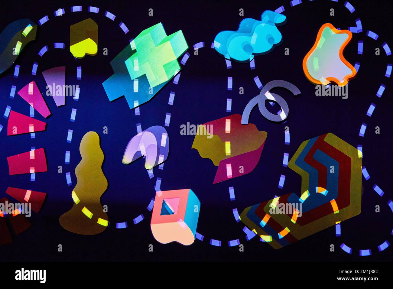 Lights on dark wall of random shapes and curvy dashed line Stock Photo ...