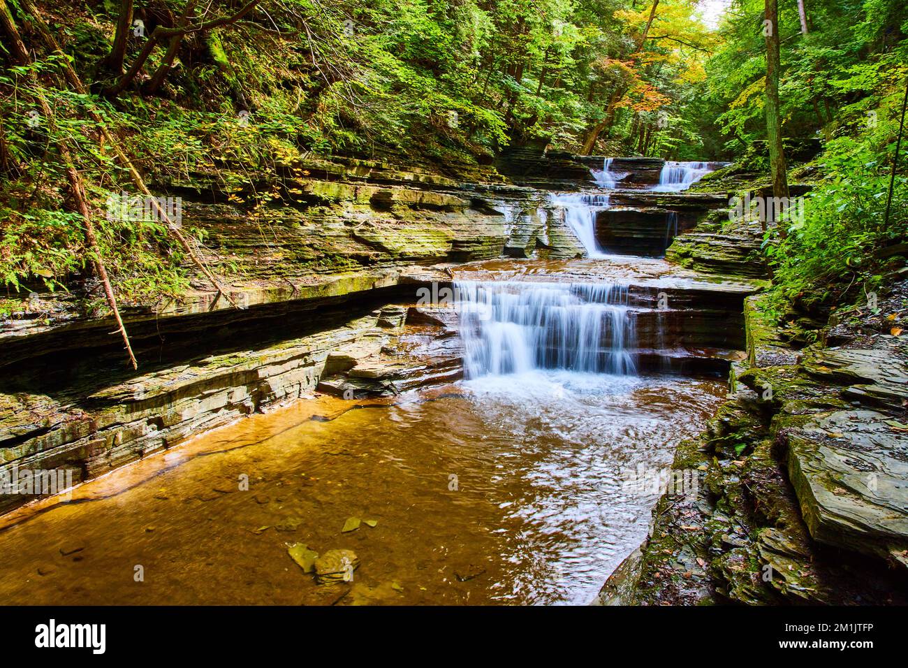 Beautiful tiers of waterfalls in rocky gorge and forest of Upstate New ...