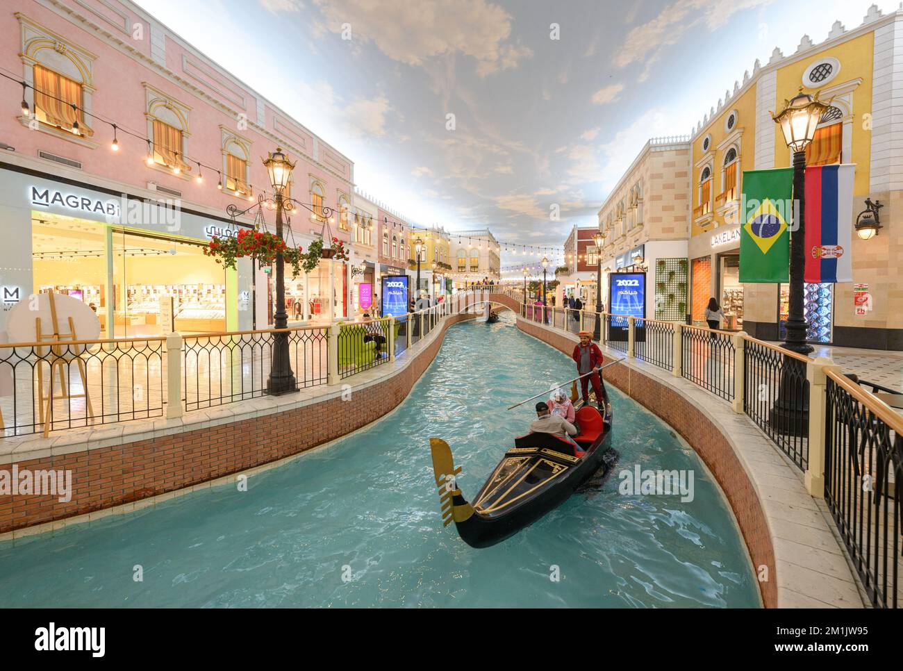 Doha, Qatar. 11th Dec, 2022. Visitors to Villaggio Mall travel through ...