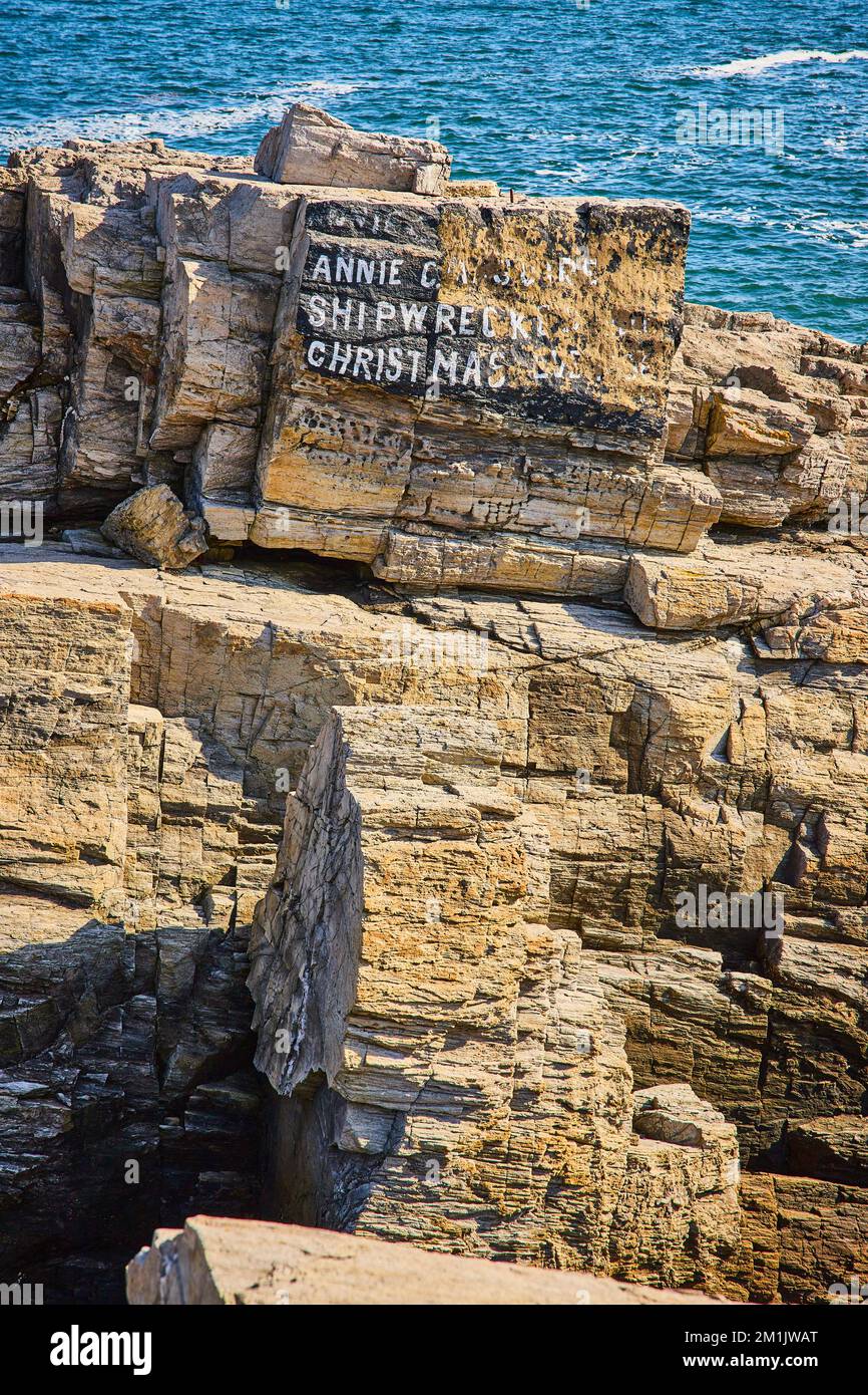 Annie C. Maguire shipwreck marker on Maine coastline Stock Photo - Alamy