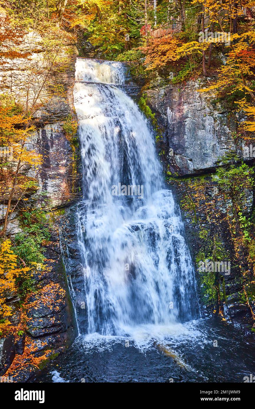 Straight on huge waterfall over cliffs with harsh light and fall ...