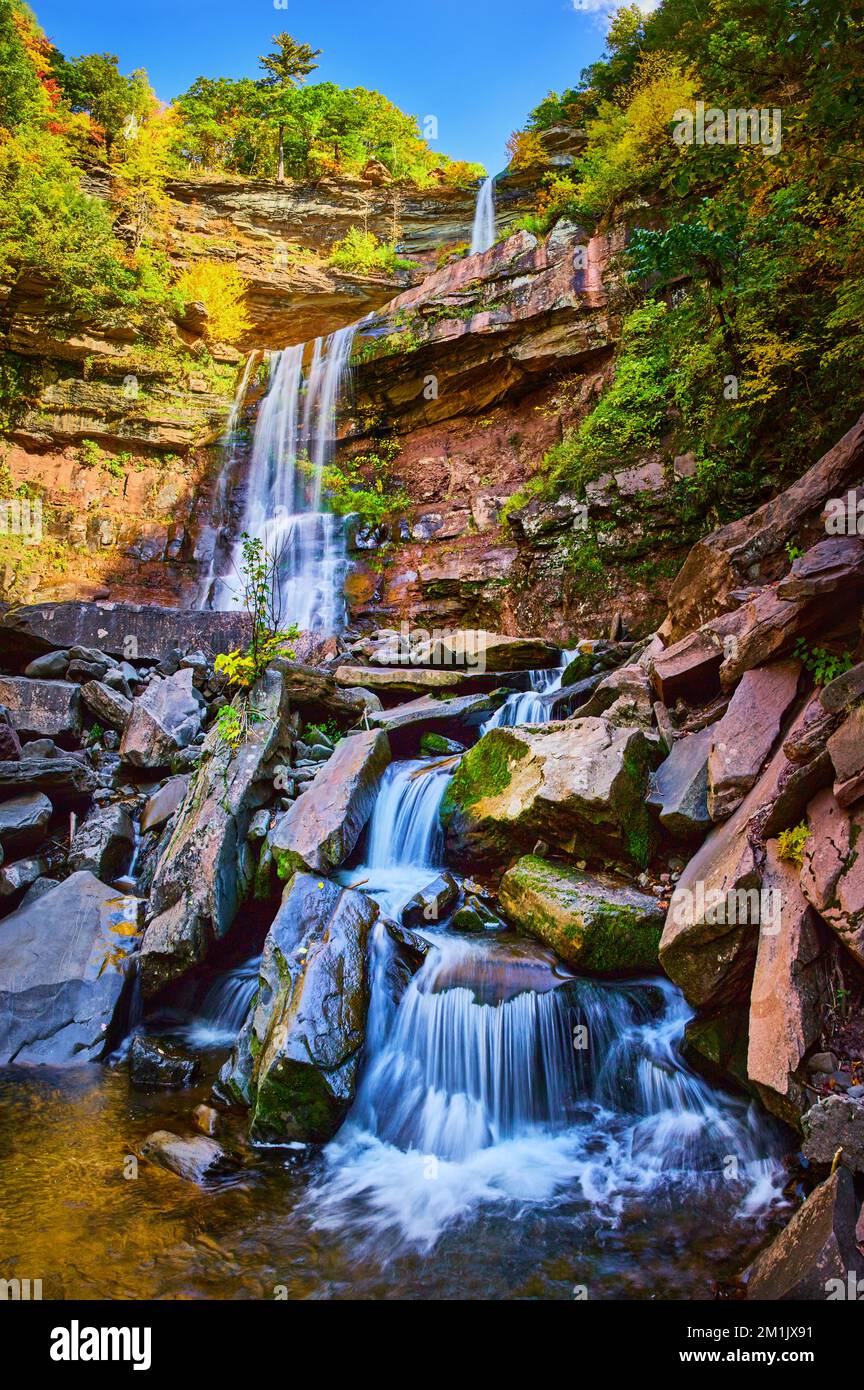 Stunning terraced waterfalls small and large from below over mossy ...