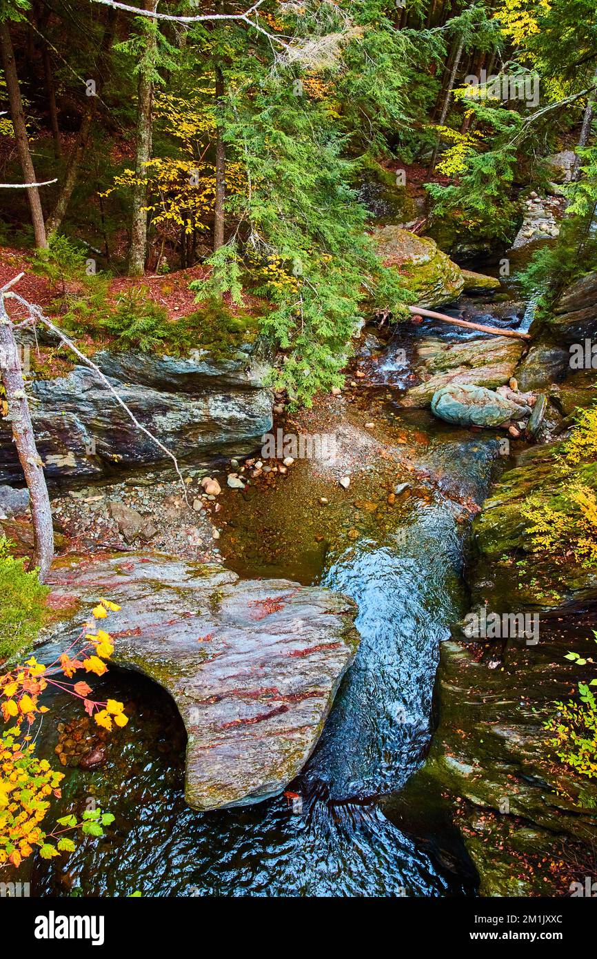 Stunning gorge from above with rocks covered in fall leaves and ...