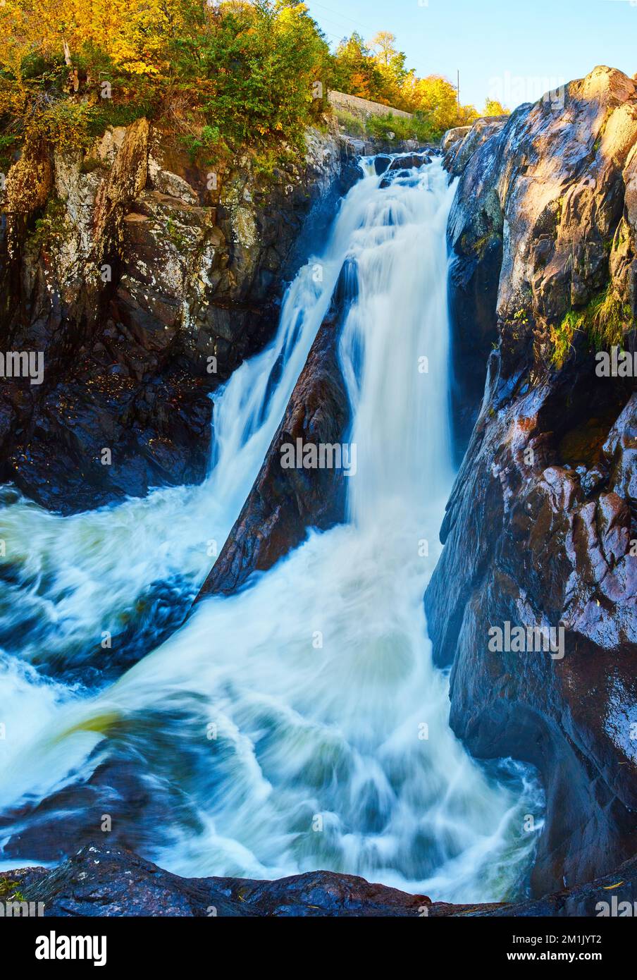 Panoramic up close view of huge waterfall pouring angry through deep ...