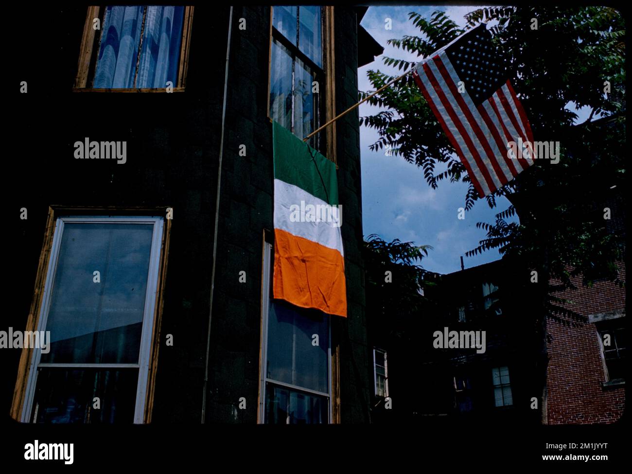 American and Irish flags outside window, Boston , Flags. Edmund L ...