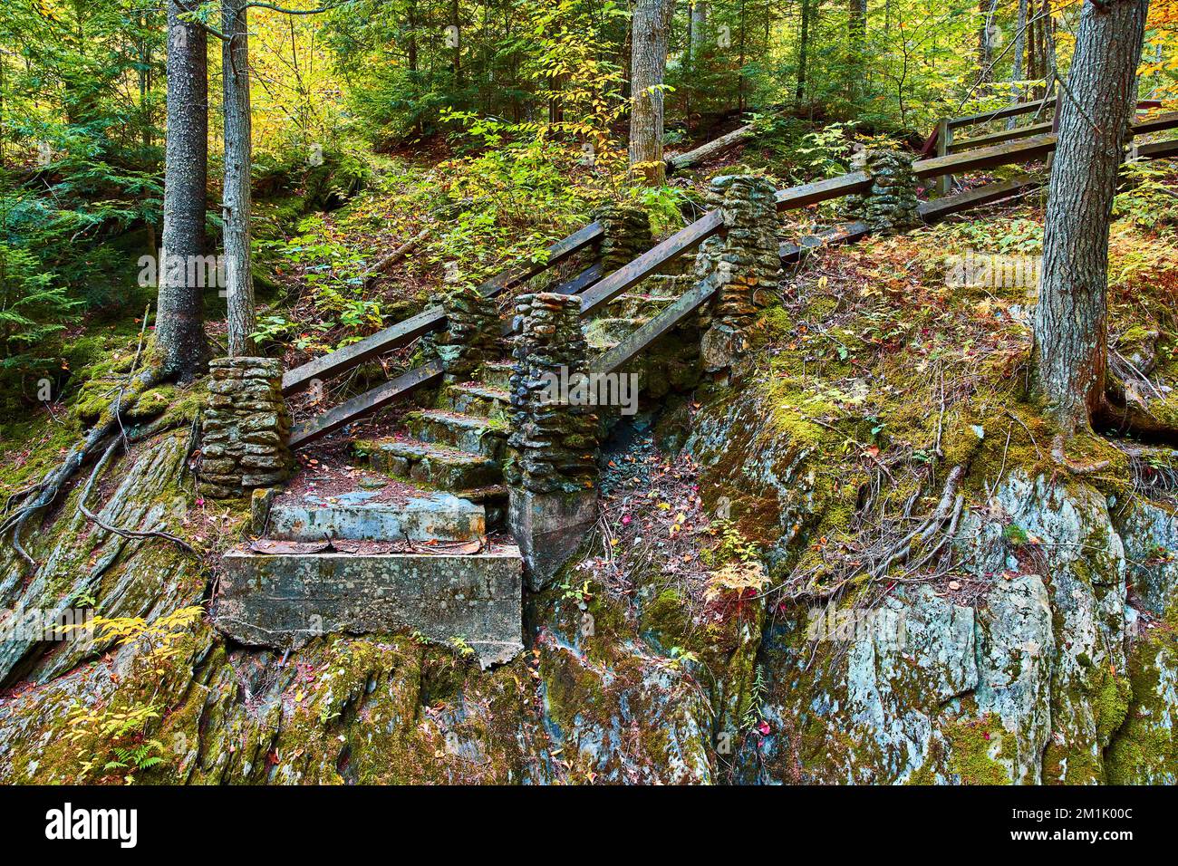 Stone steps of path leading to dead end dangerous along mossy cliff ...