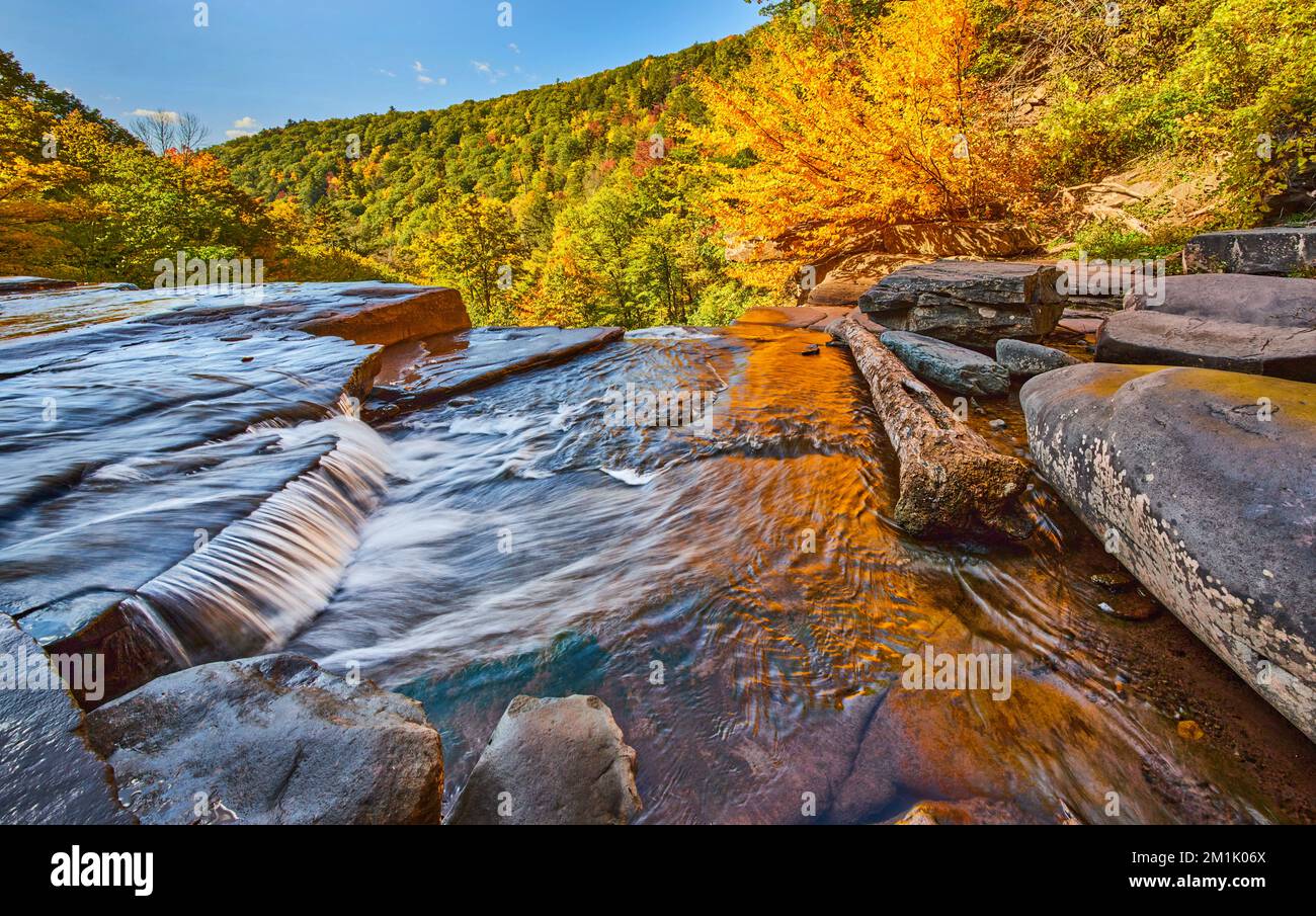 Small waterfall terrace over rocks leading to cliff edge and fall ...