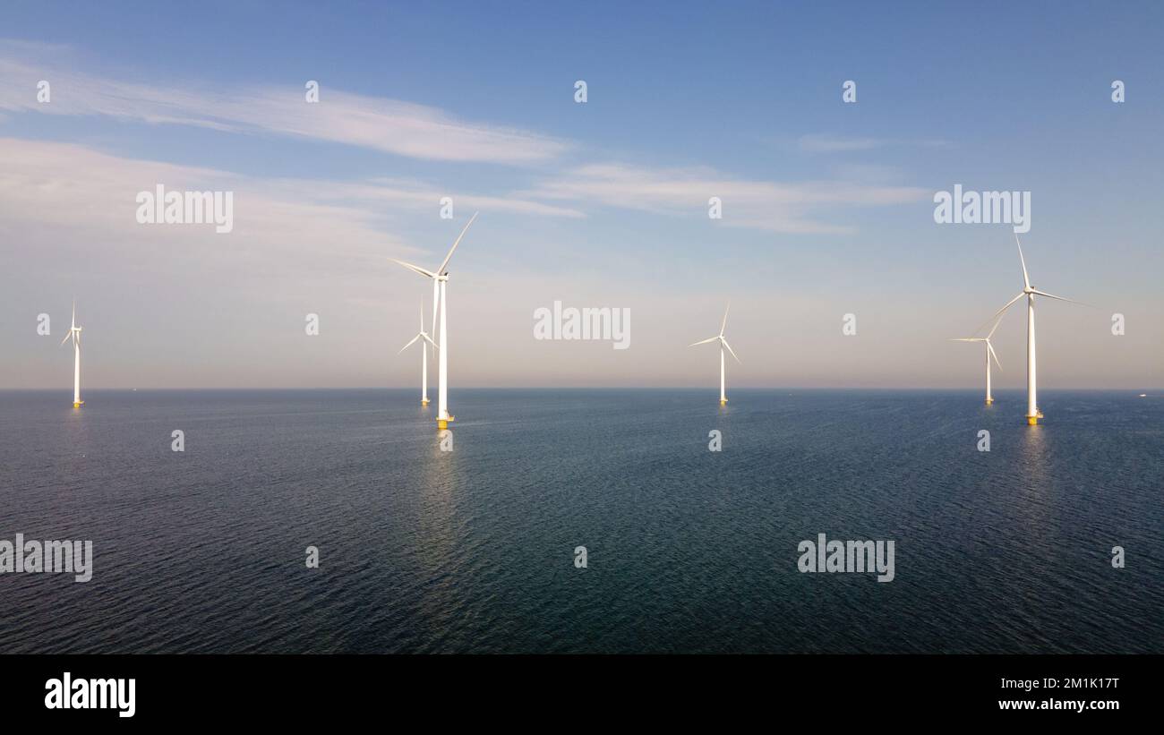Drone Aerial view at Windmill park with windmills turbines in the ocean ...