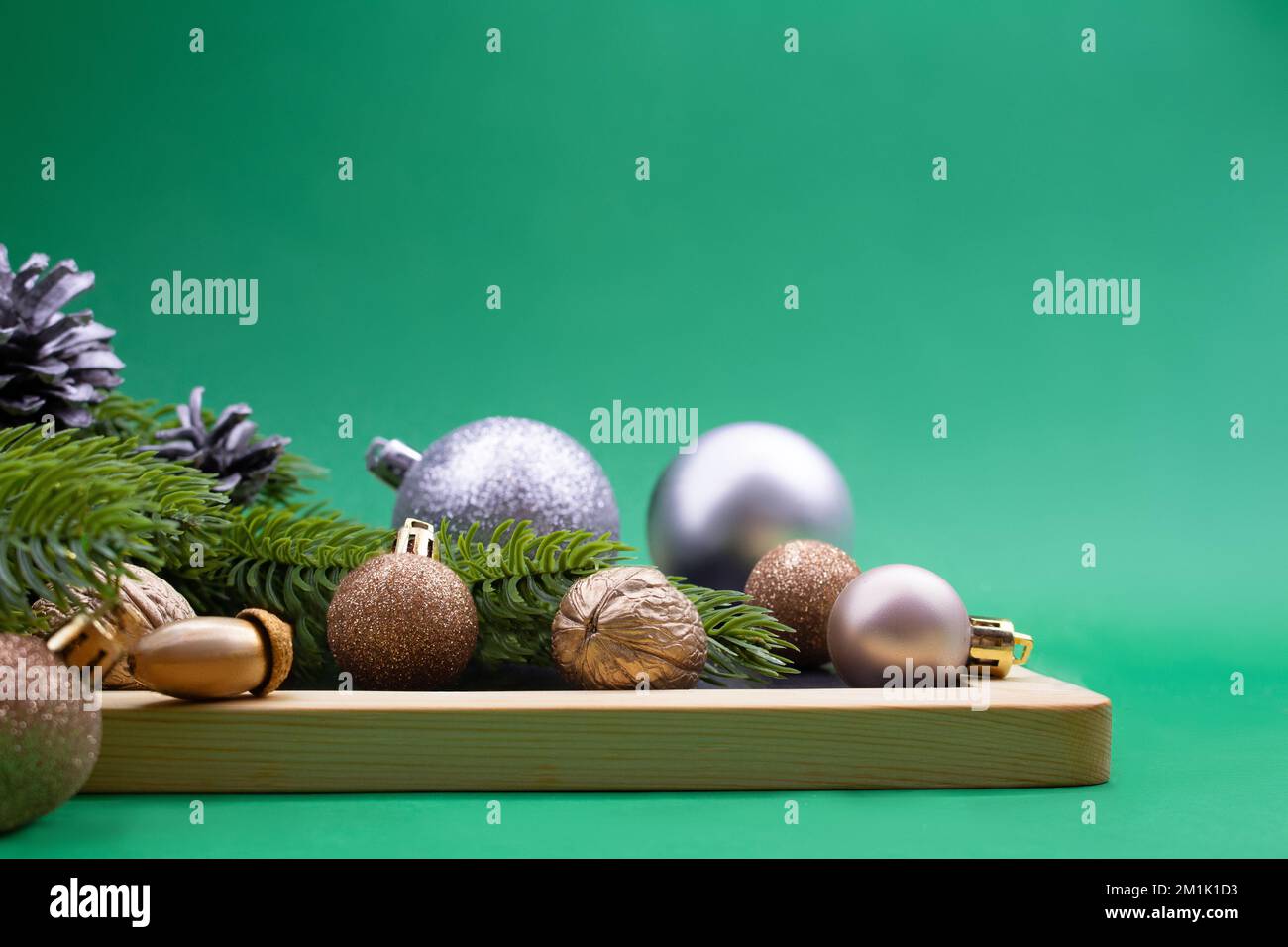 Silver and gold balls, walnut, acorn with spruce branches on pedestal ...