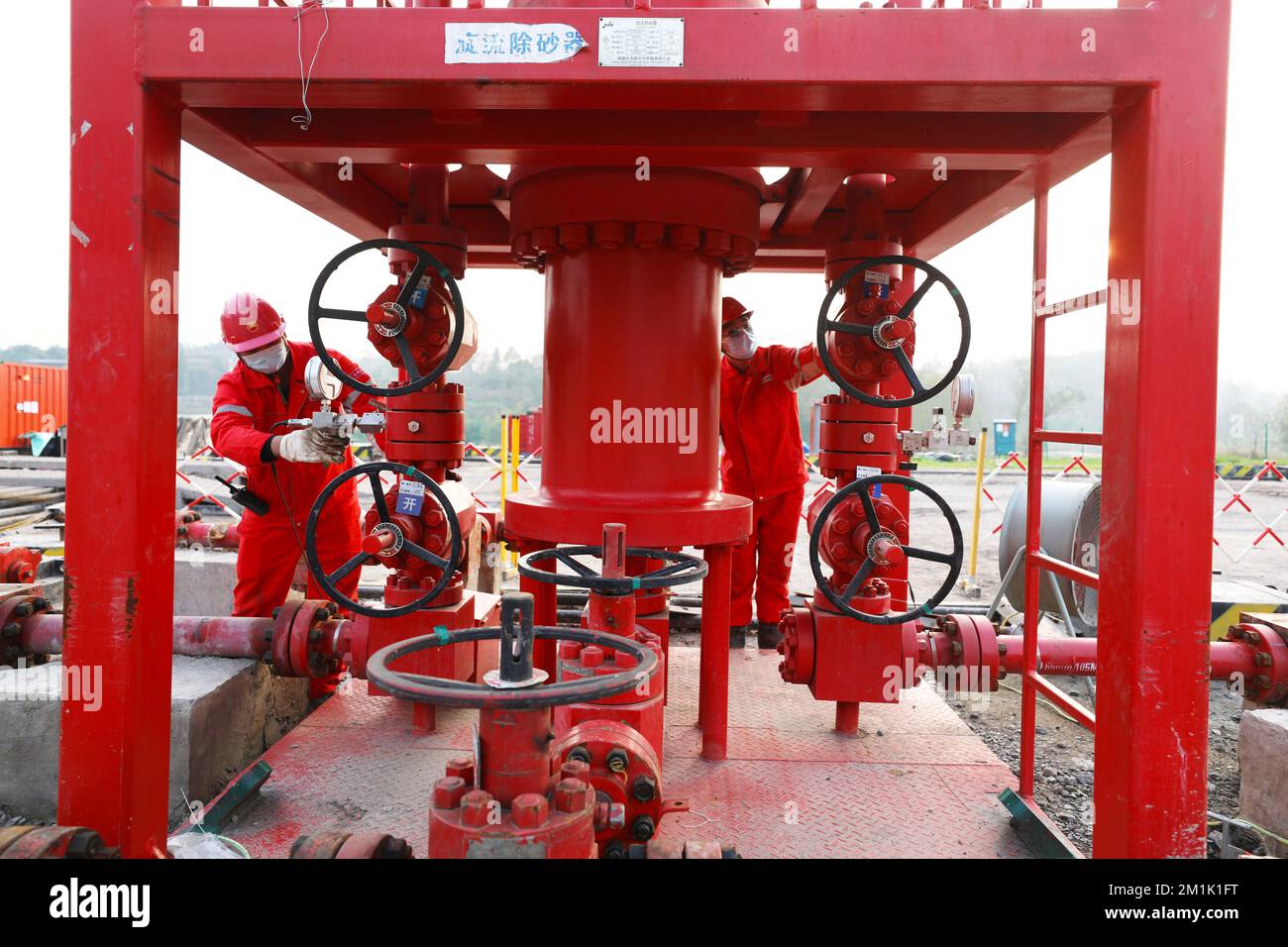 CHONGQING, CHINA - DECEMBER 12, 2022 - Workers check equipment at Daye ...