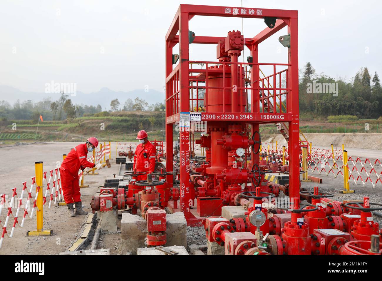 CHONGQING, CHINA - DECEMBER 12, 2022 - Workers check equipment at Daye ...