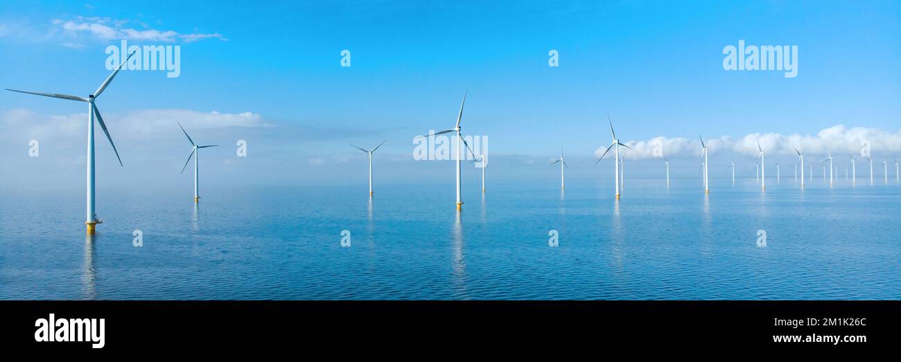 Renewable energy Windmill park with windmills turbines in the ocean ...